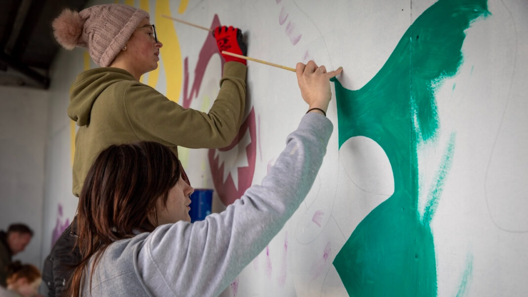 Business Partnership Tackles Striking Football Mural - Business Mondays